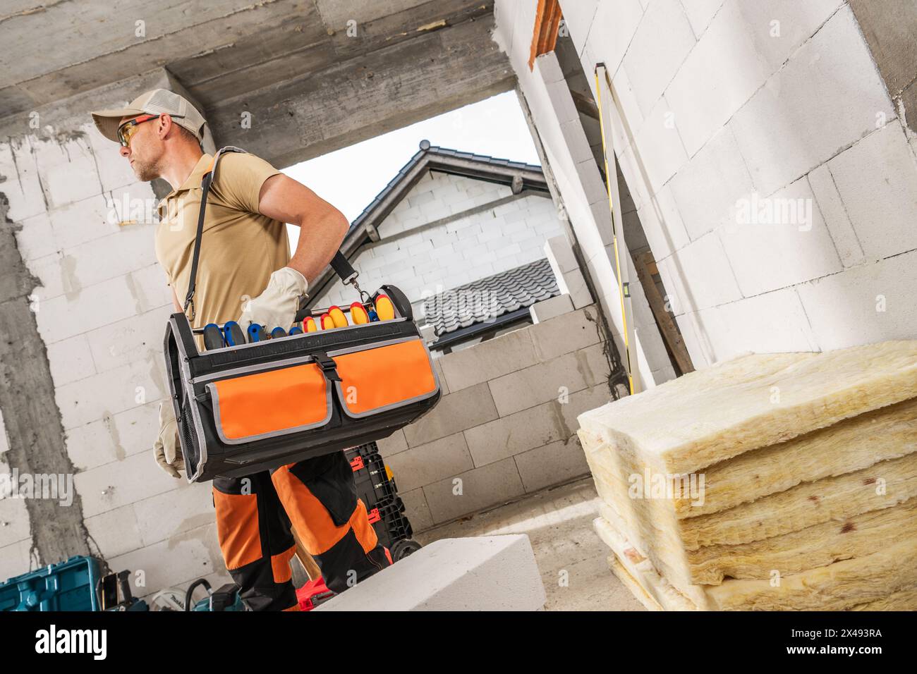 Caucasian Professional Construction Worker with a Tool Box Hanged on ...