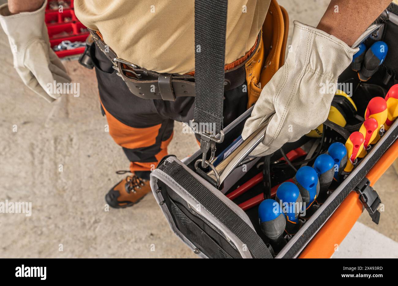 Construction Worker Moving with a Tool Box Hanged on His Shoulder Stock ...