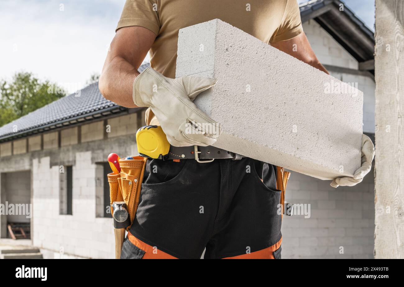General Building Bricklayer Contractor Moving Concrete Bricks Along ...