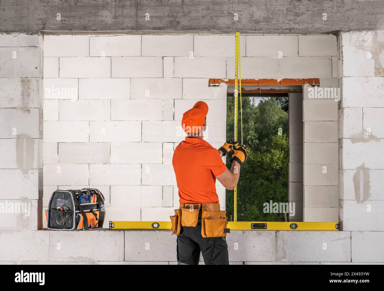 House Windows Installer Taking Measurements in Newly Developed Bricks ...