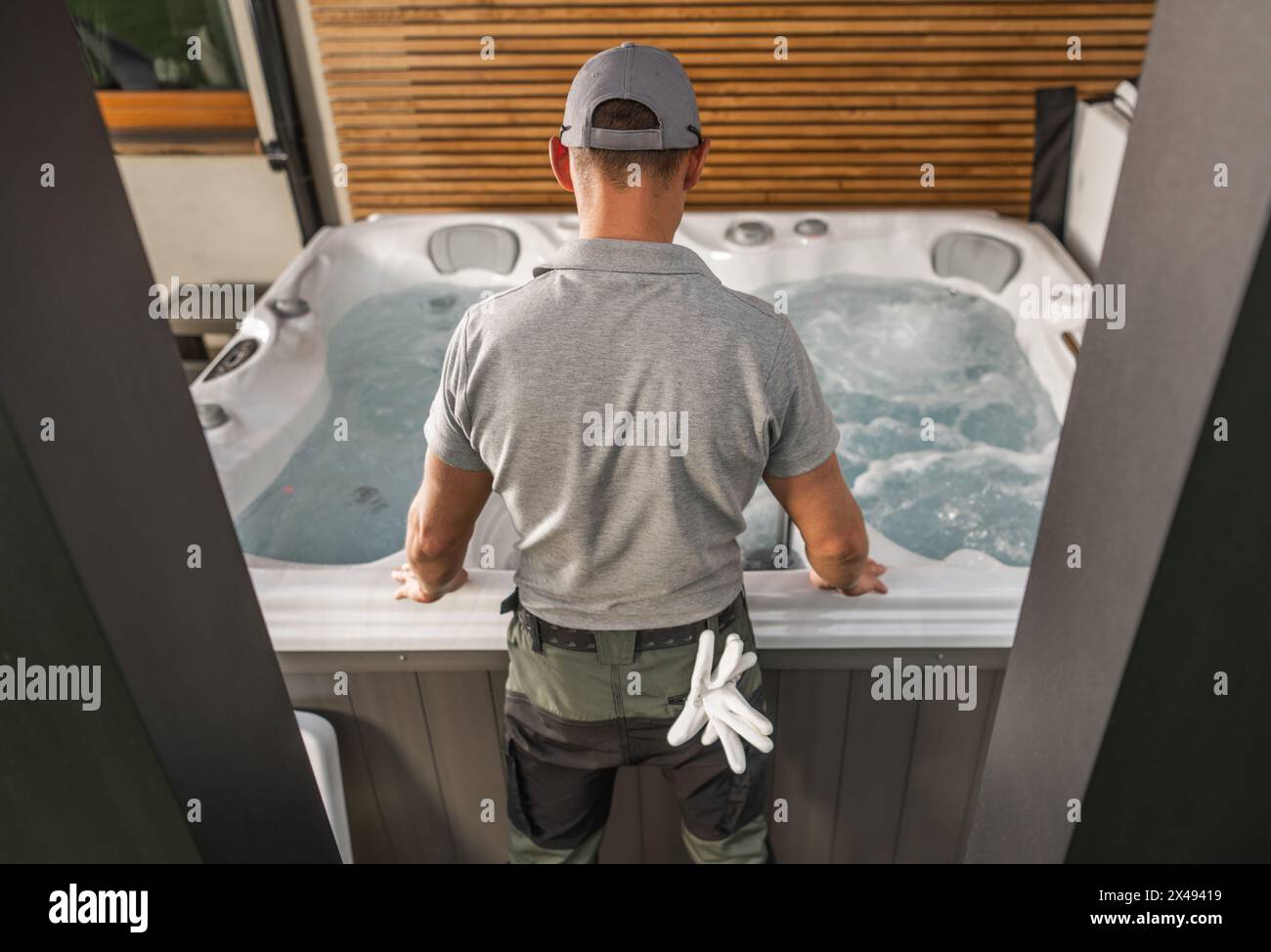 Caucasian Hot Tub Technician Performing Outdoor SPA Maintenance Stock ...