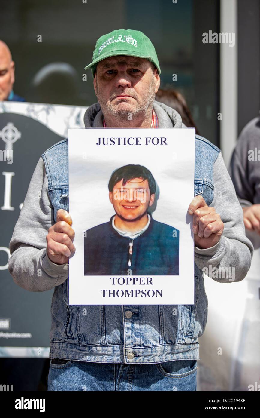 Eugene Thompson holds an image of his brother Liam Paul 'Topper ...