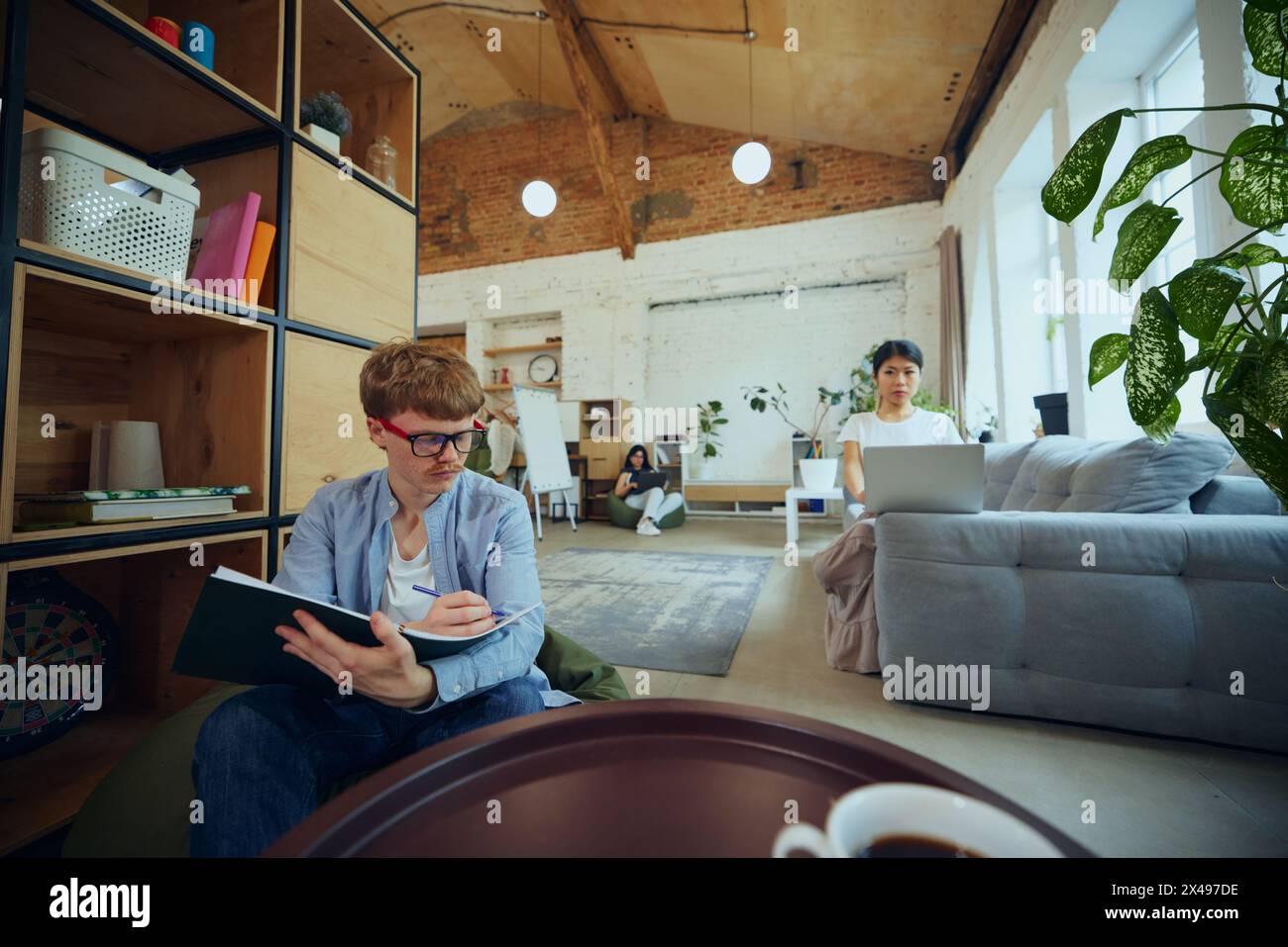 Dynamic workday. Young multiethnic people meeting in co-working ...