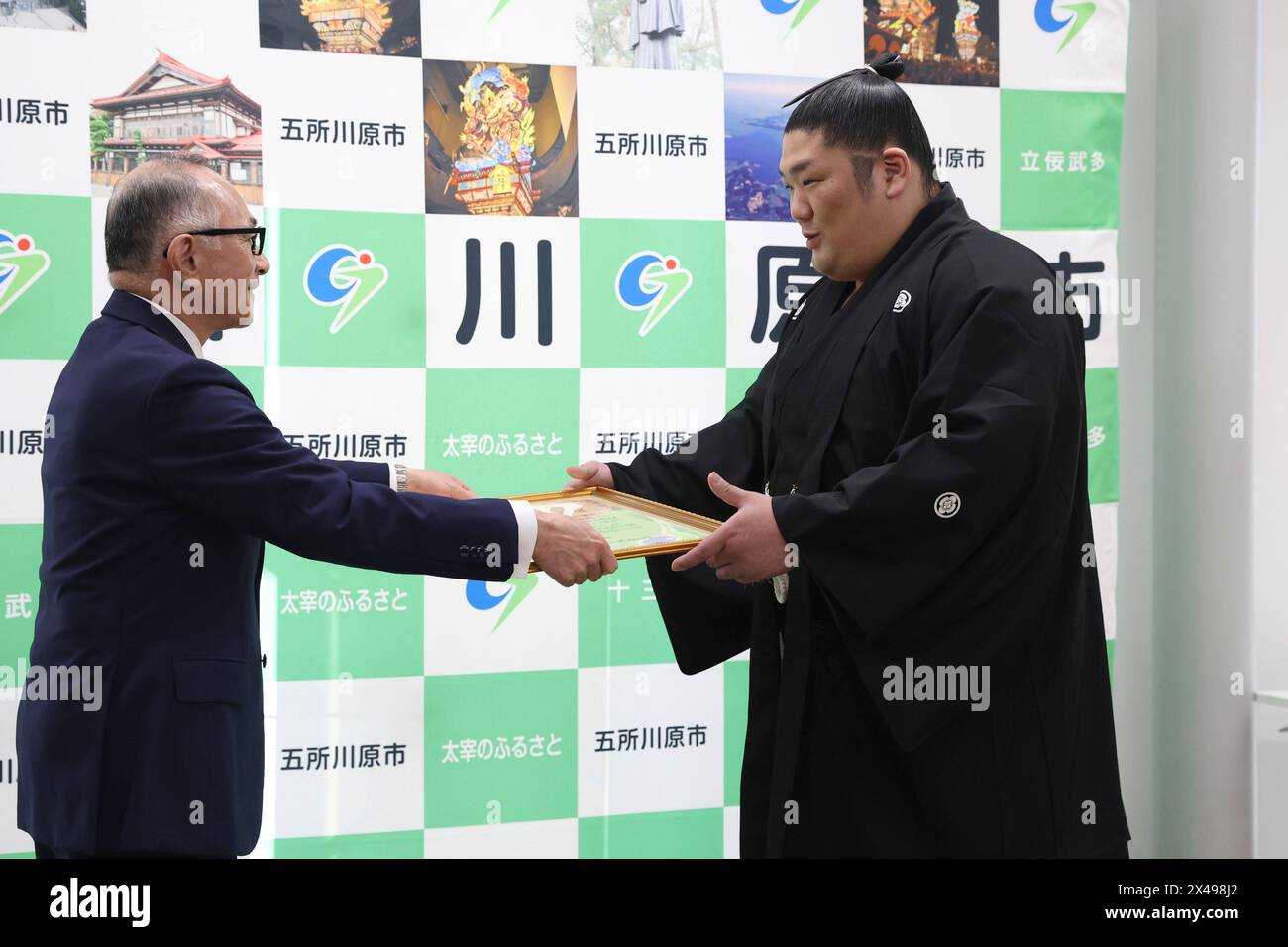 Sumo wrestler Takerufuji (R), makuuchi debutant receives Citzen Honor ...