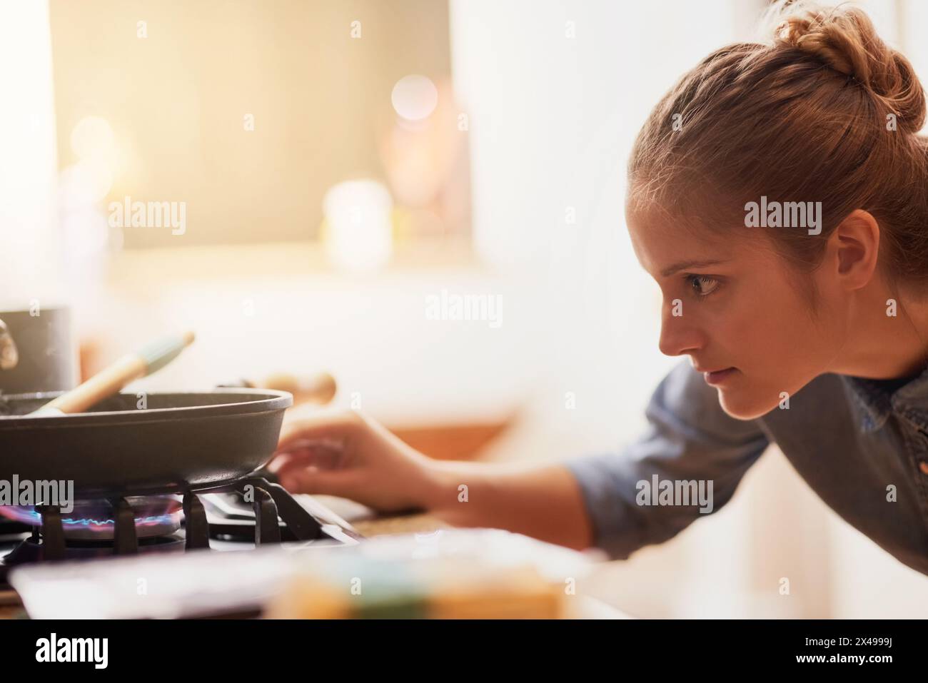 Cooking, home and woman light gas stove in kitchen for healthy diet ...
