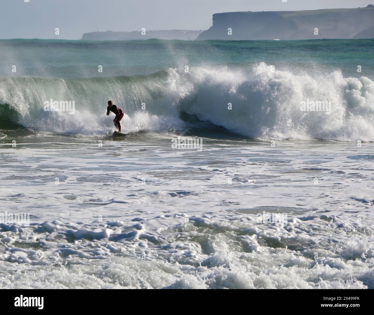 A surfer on a sunny October morning with 10 foot waves Sardinero ...