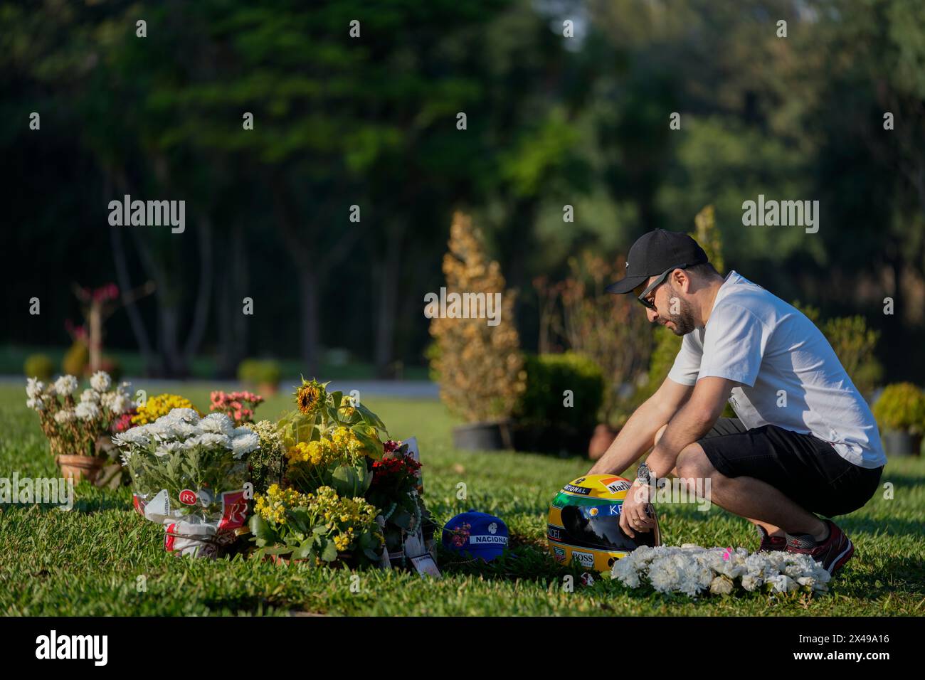 A fan visits the burial site of late Brazilian Formula One driver ...