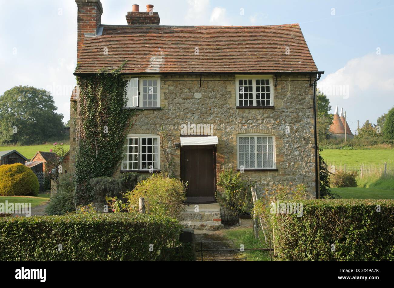 Stone House in Kent Countryside with oast houses in background Stock ...