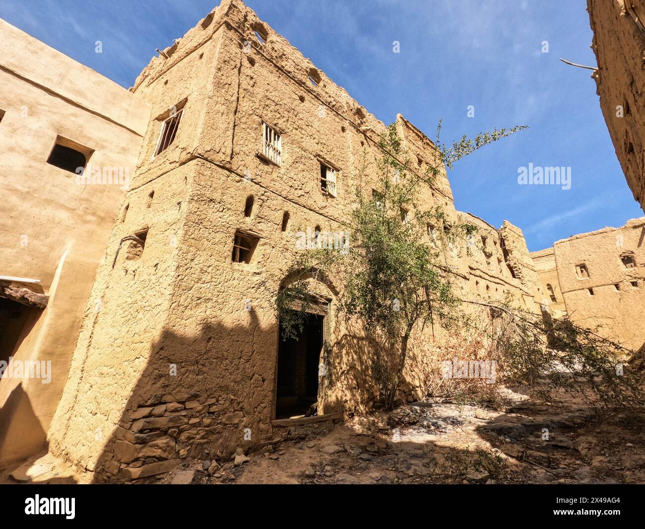 Falling down mud-brick ruins of the old village in Al Hamra, Oman Stock ...