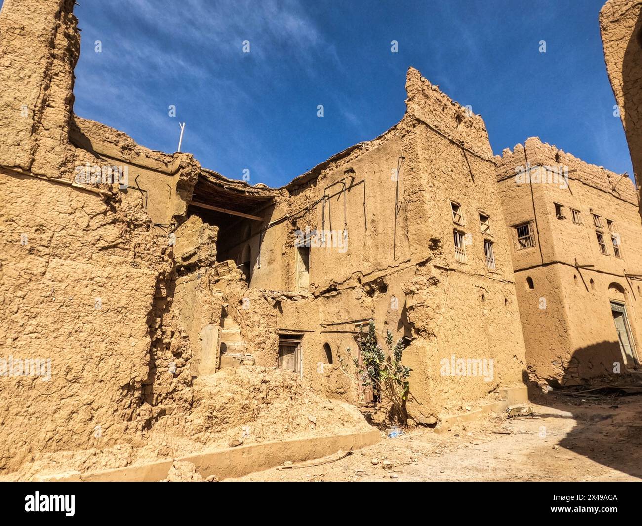 Falling down mud-brick ruins of the old village in Al Hamra, Oman Stock ...