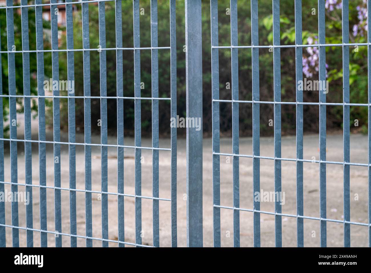borders, the fence with steel metal grate. Detail of the grate is made ...