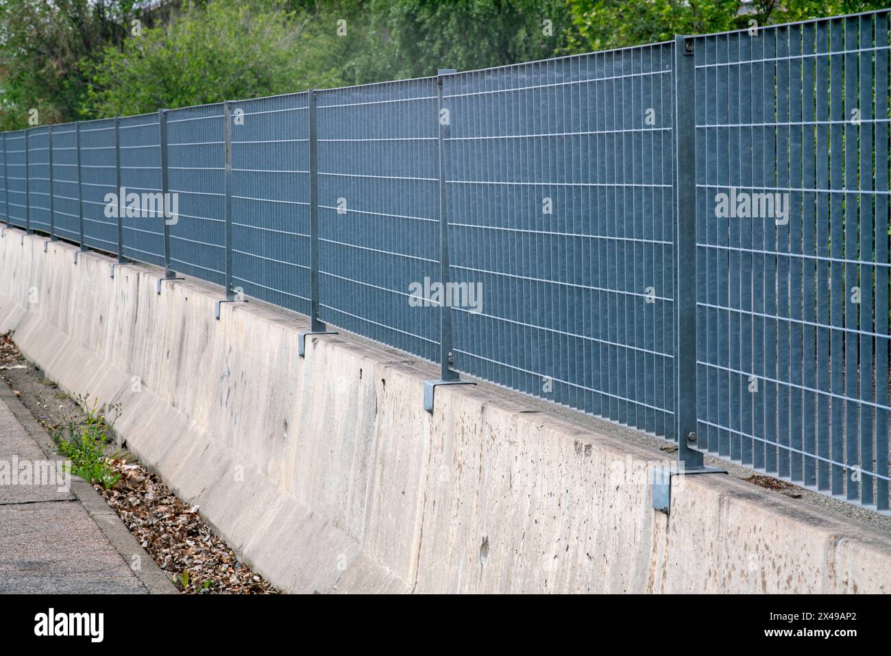 borders, the fence with steel metal grate. Detail of the grate is made ...