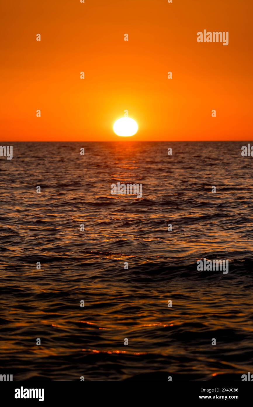 The scenic sunrise over the Caspian sea at the Makhachkala shore in the ...