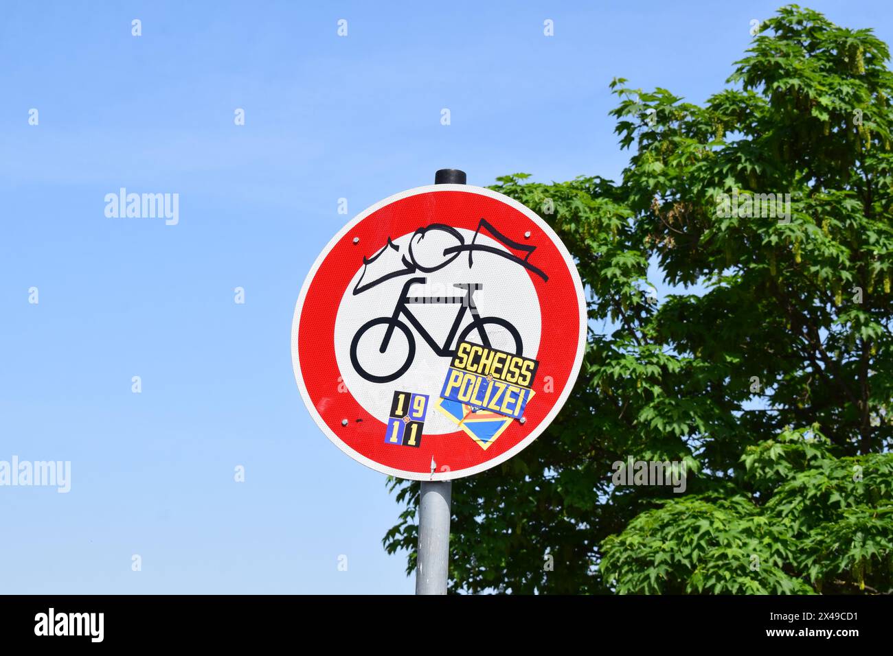vandalized traffic sign, no entry for bikes Stock Photo - Alamy