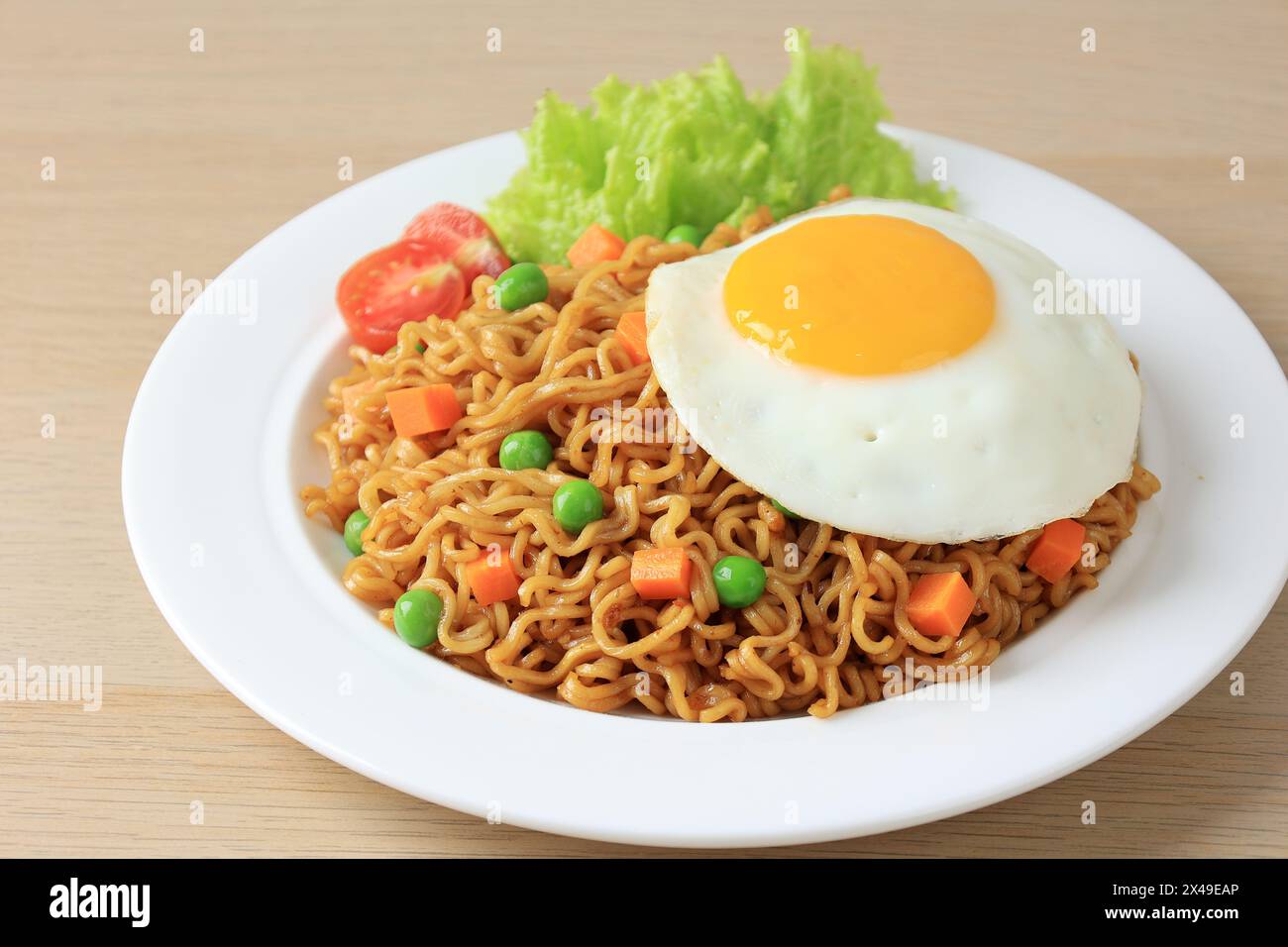 Fried Noodle Indomie Goreng with Sunny Side Egg. Popular Indonesian ...