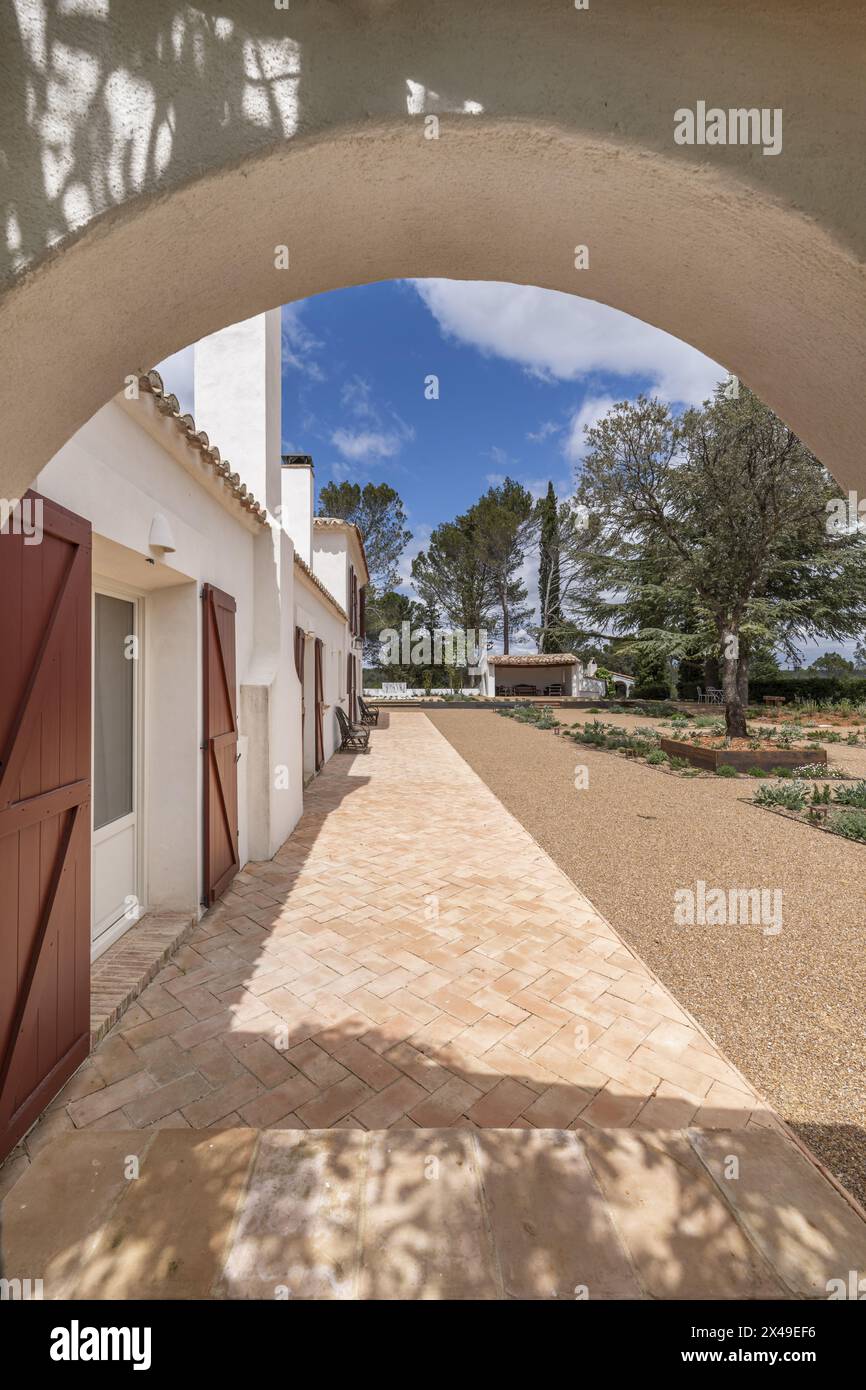 Perimeter hallway with terracotta floors in an Andalusian-style country ...