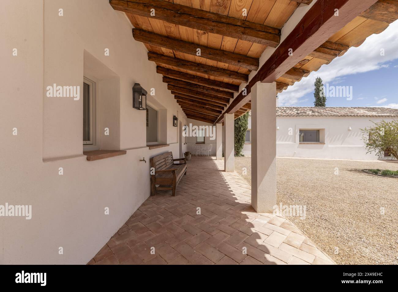 Covered porch with wooden roof of an Andalusian style country house ...