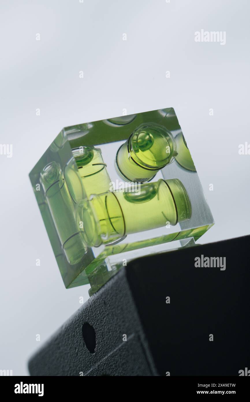 A spirit level is used to accurately measure whether a surface is level ...