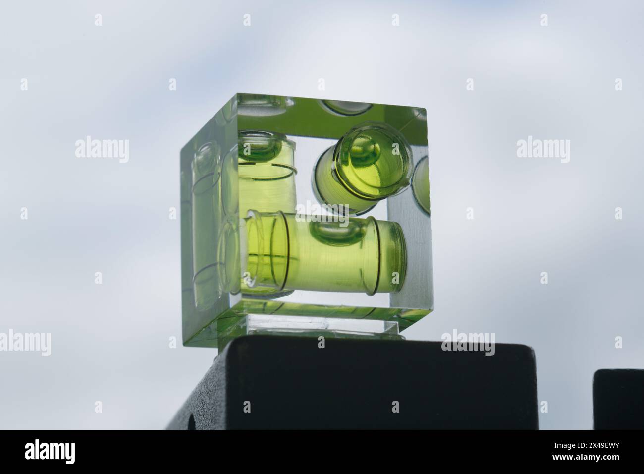 A spirit level is used to accurately measure whether a surface is level ...