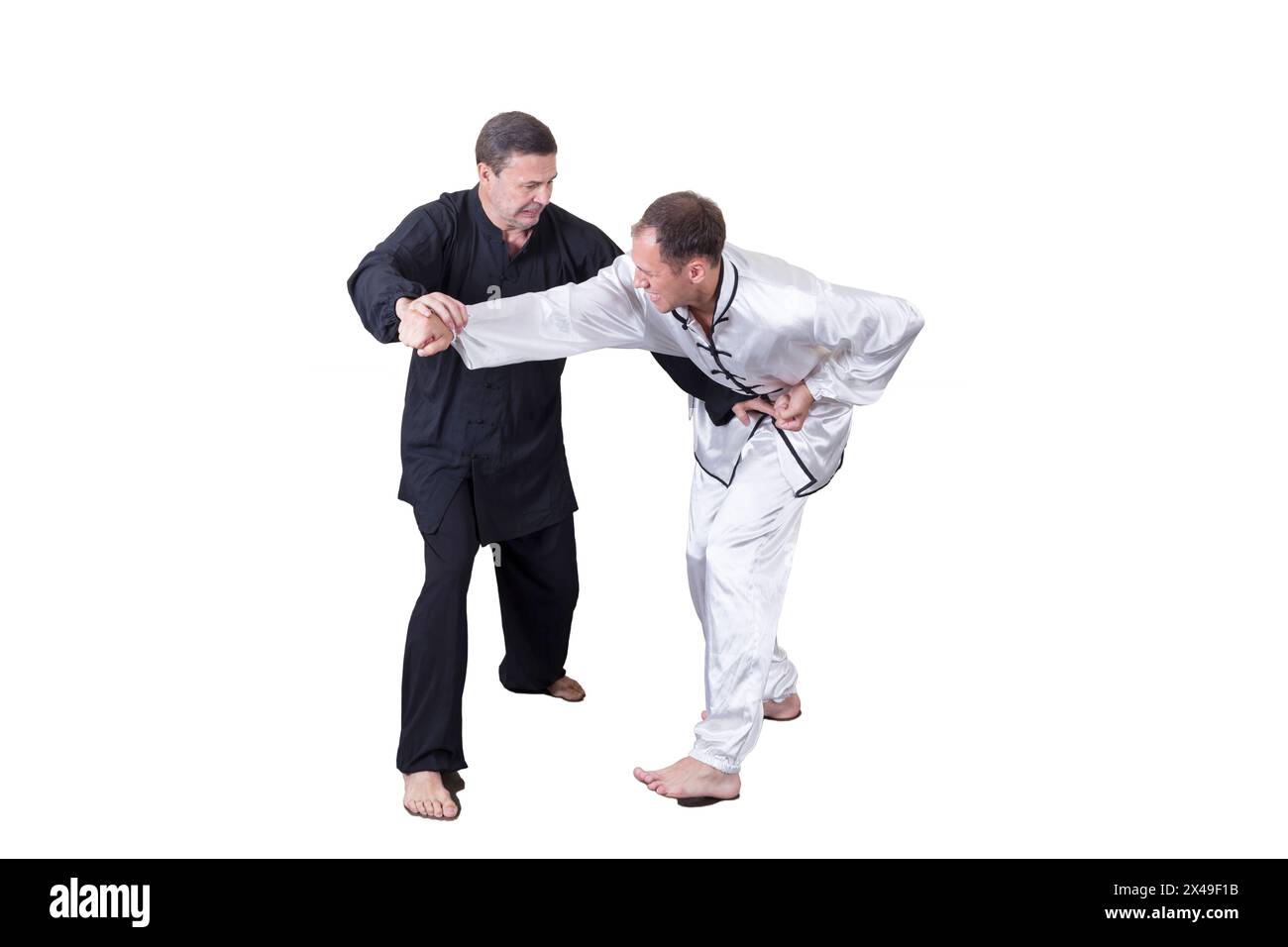 Adult athlete performs formal goju-ryu exercises. It is isolated in a ...