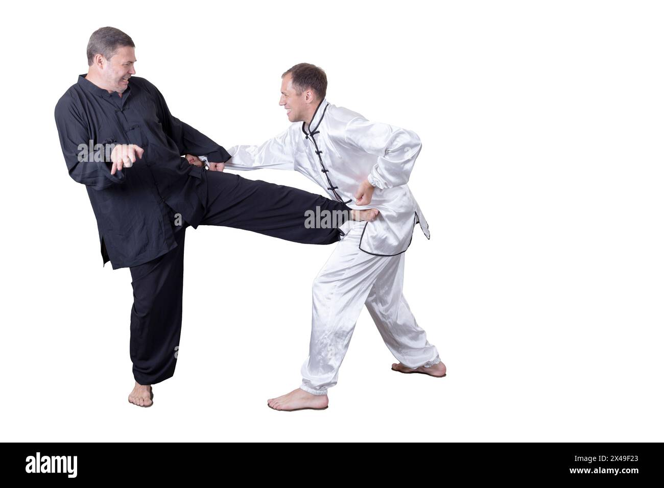 Adult athlete performs formal goju-ryu exercises. It is isolated in a ...