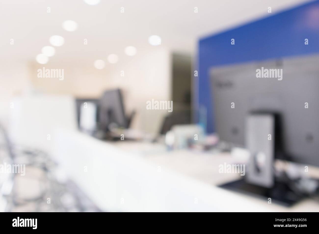 Abstract blur office desk workplace or hospital with computer defocused ...
