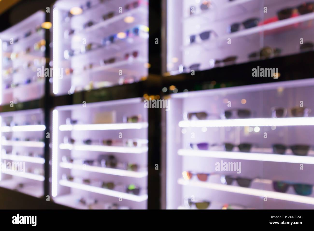 Blur Sunglasses on display shelves in glasses store background Stock ...