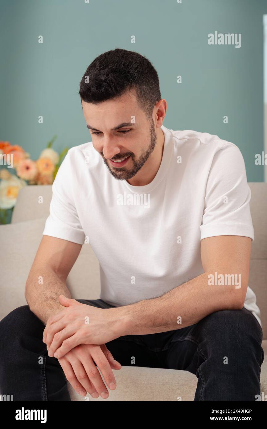 Displeased man sitting sofa living hi-res stock photography and images ...