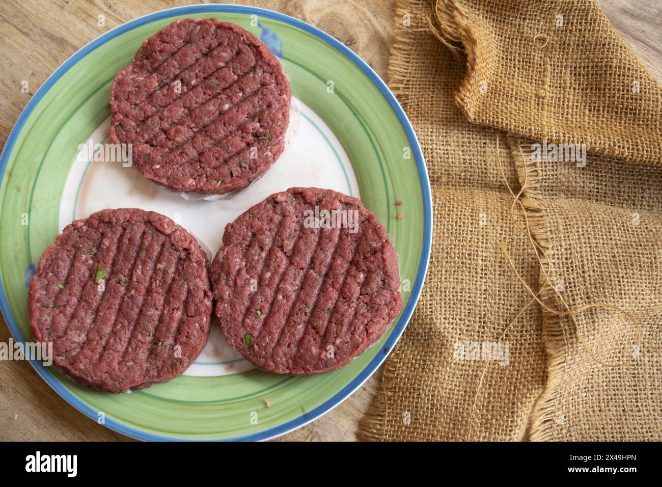 raw beef hamburger ready to be cooked Stock Photo - Alamy