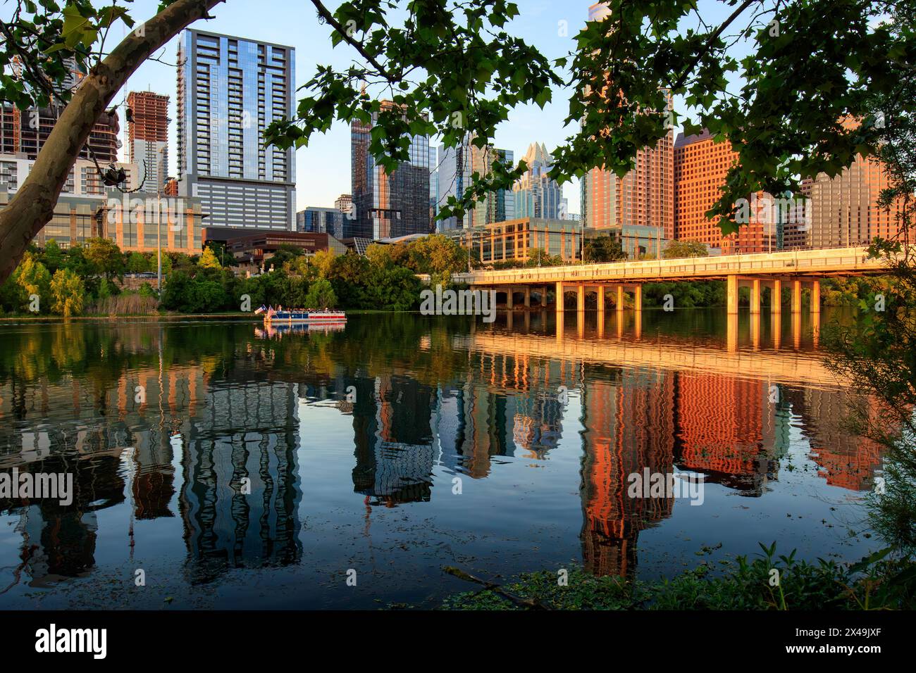 Lady Bird Lake reflects the skyline of the modern city of Austin Texas ...
