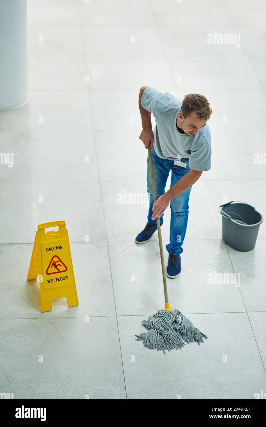 Man, janitor and mopping office for cleaning job or hygiene with ...