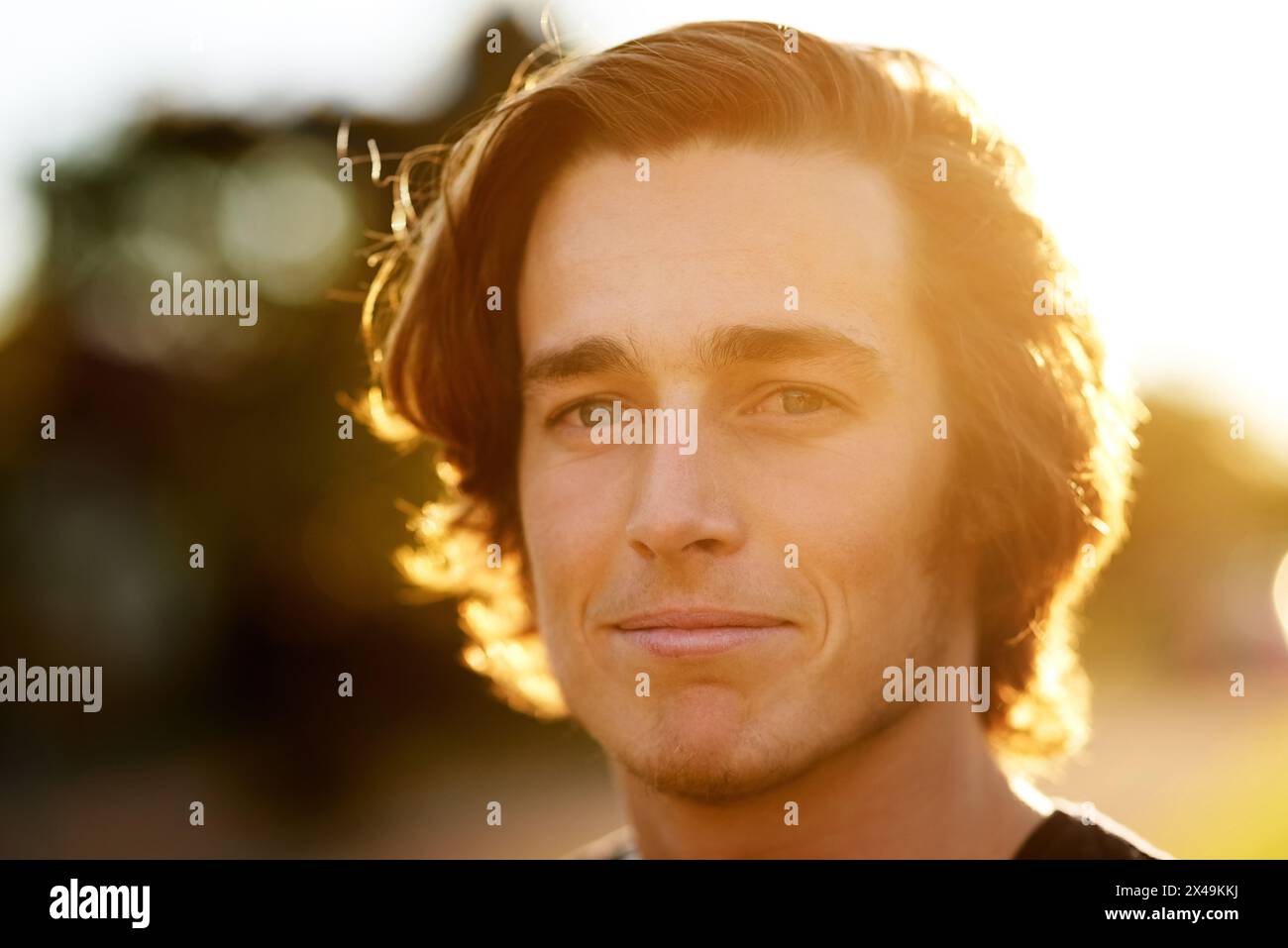 Portrait, man and smile with sunlight for adventure, positive and proud ...