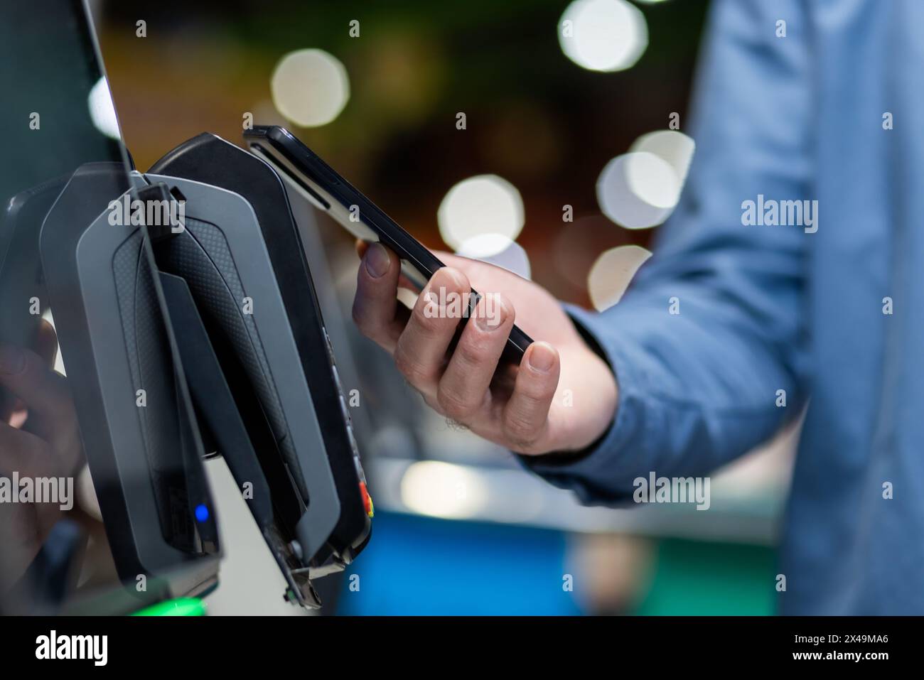 Close up of unrecognizable caucasian person touching terminal with ...