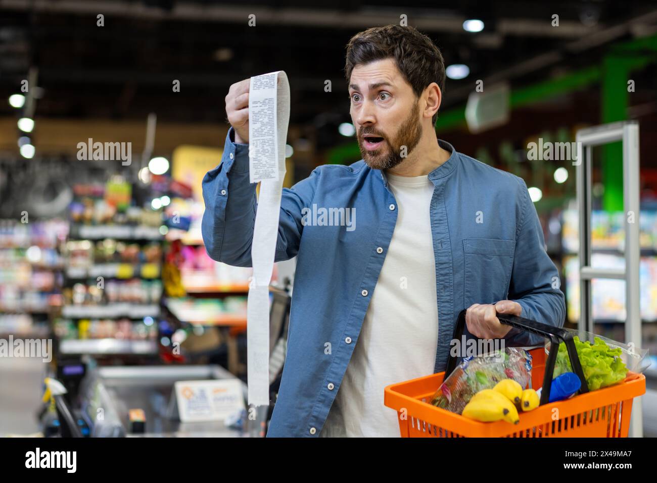 Shocked caucasian man with rounded eyes and open mouth looking at ...