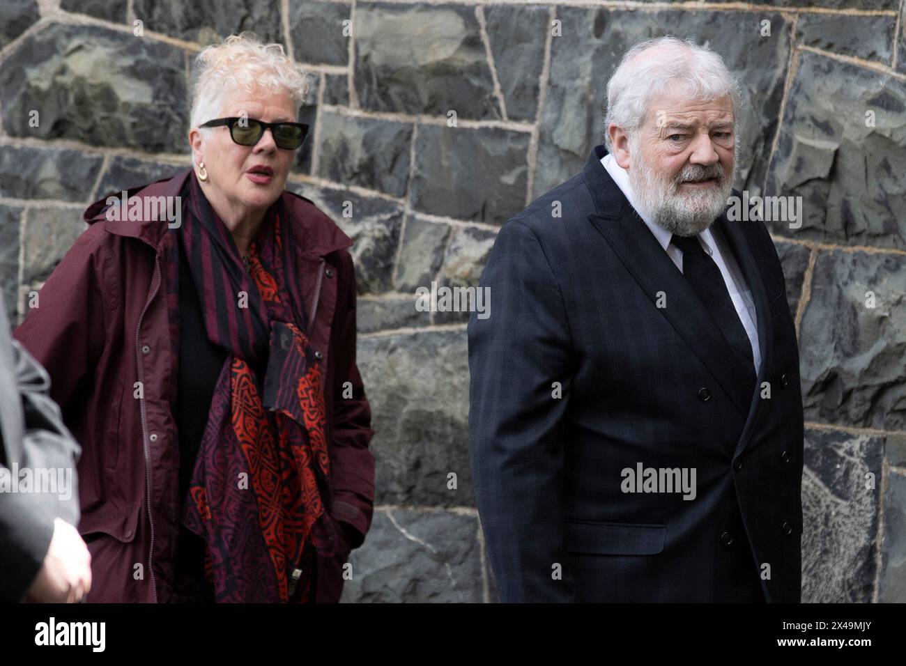 Liz Kennedy (left) and Ivan Martin attend the funeral of former BBC ...