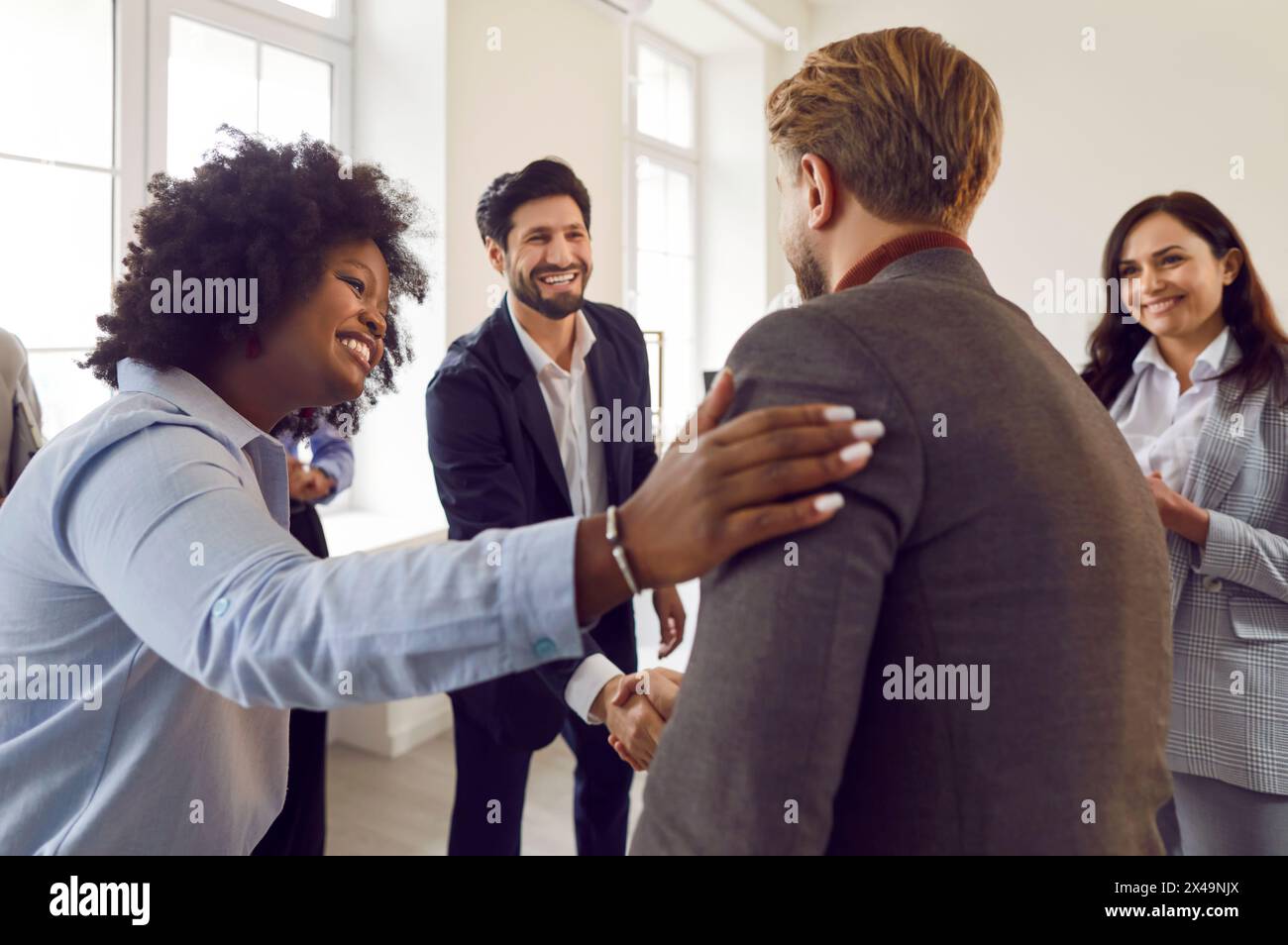 Business people in office making deal shaking hands with each other ...