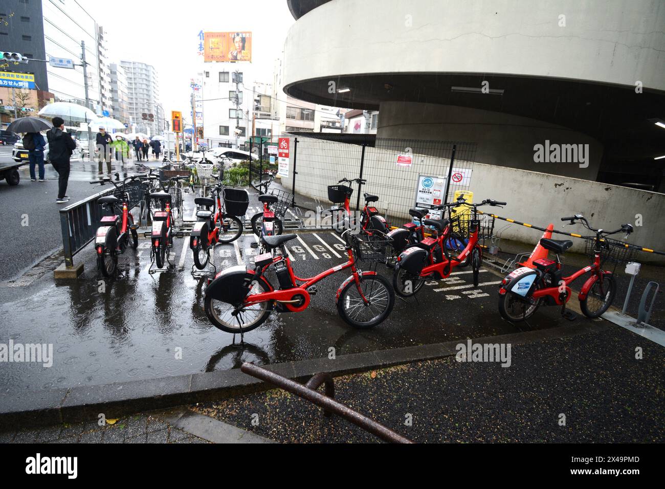 Tokyo Japan in the rain with umbrellas people hiding from the rain wet ...