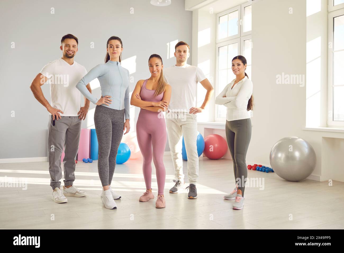 Group Portrait of a Fitness People in the Gym Stock Photo - Alamy