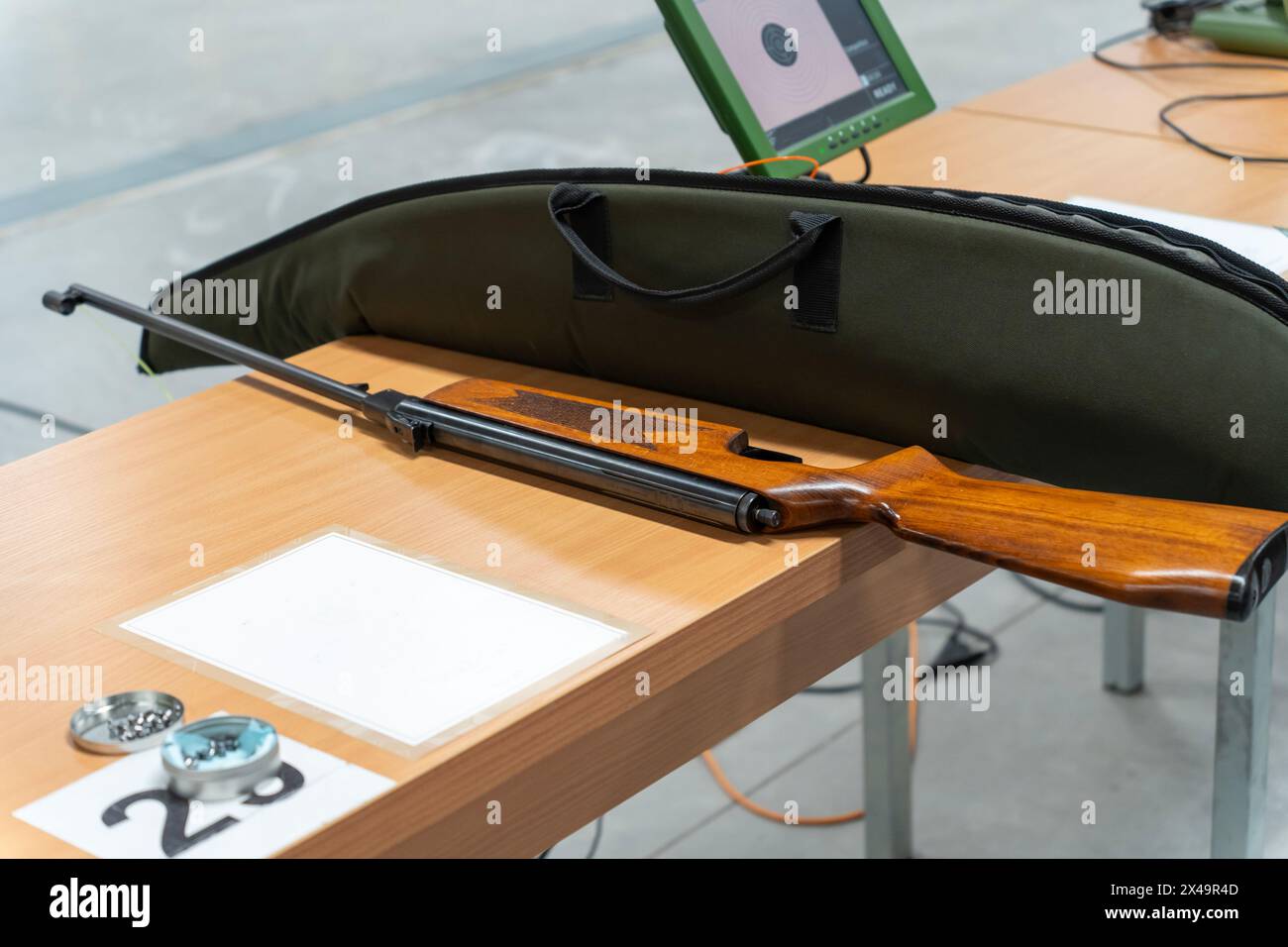 Air rifle, gun bag on a table at a shooting range at a shooting ...