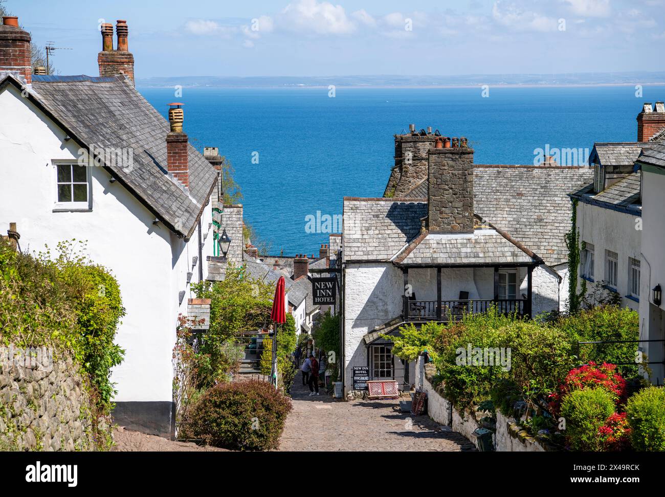 The steep cobbled main street through the picturesque village of ...