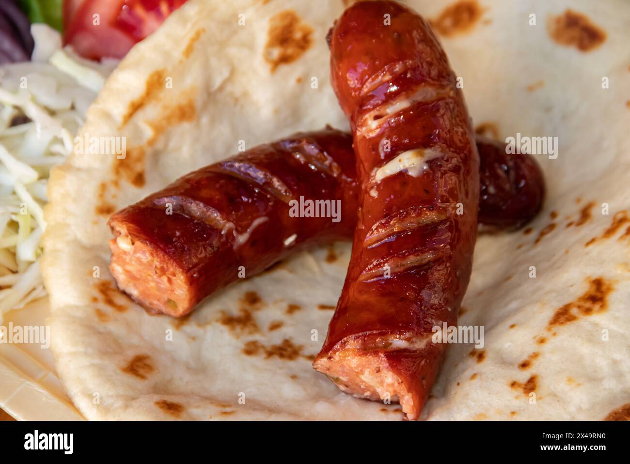 Tortilla wrap, a delightful fusion of savory sausages, crispy French ...