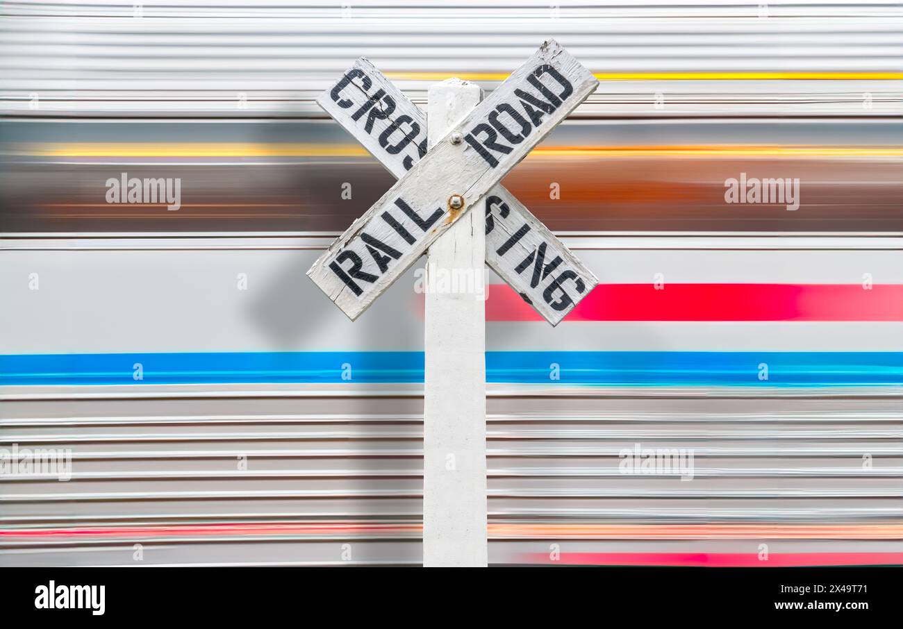 A High-Speed Train Moving Past A Wooden Railroad Crossing Sign In The ...