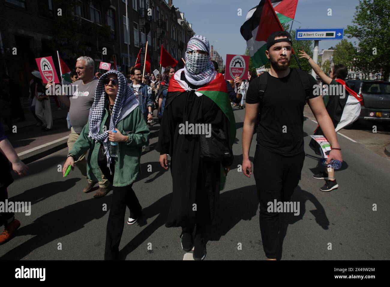 Pro-Palestine supporters take part during marches protests on May 1 ...
