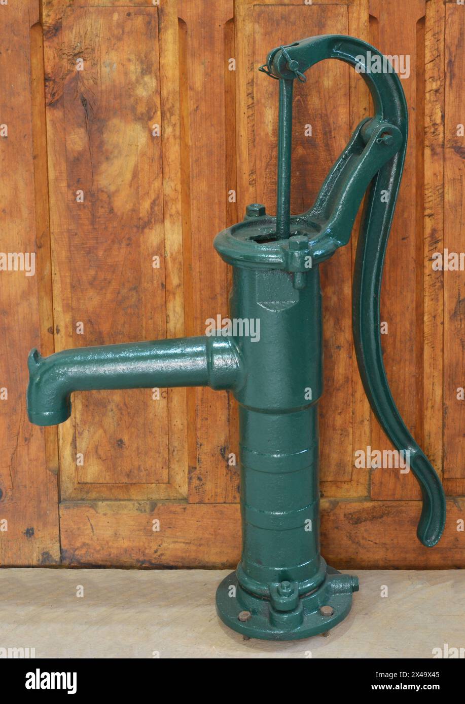 Green Vintage garden hand water pump Stock Photo - Alamy