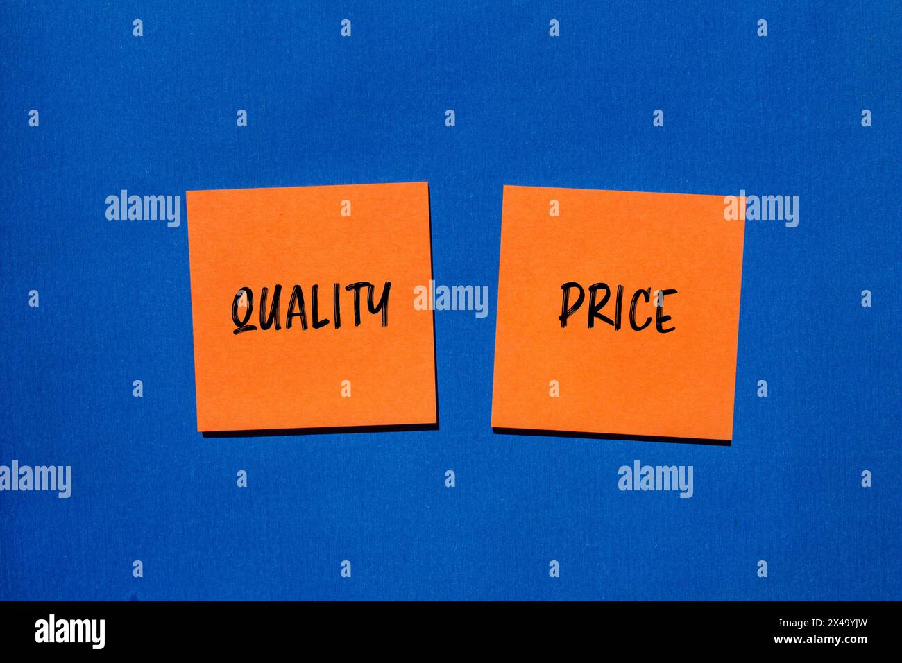 Quality price words written on orange stickers with blue background ...