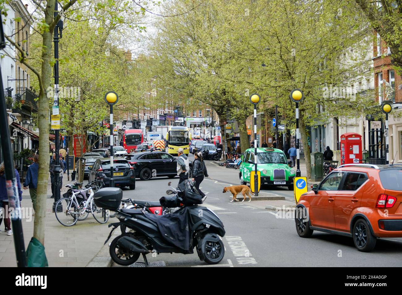 LONDON- APRIL 22, 2024: Hampstead Village high street scene- an ...