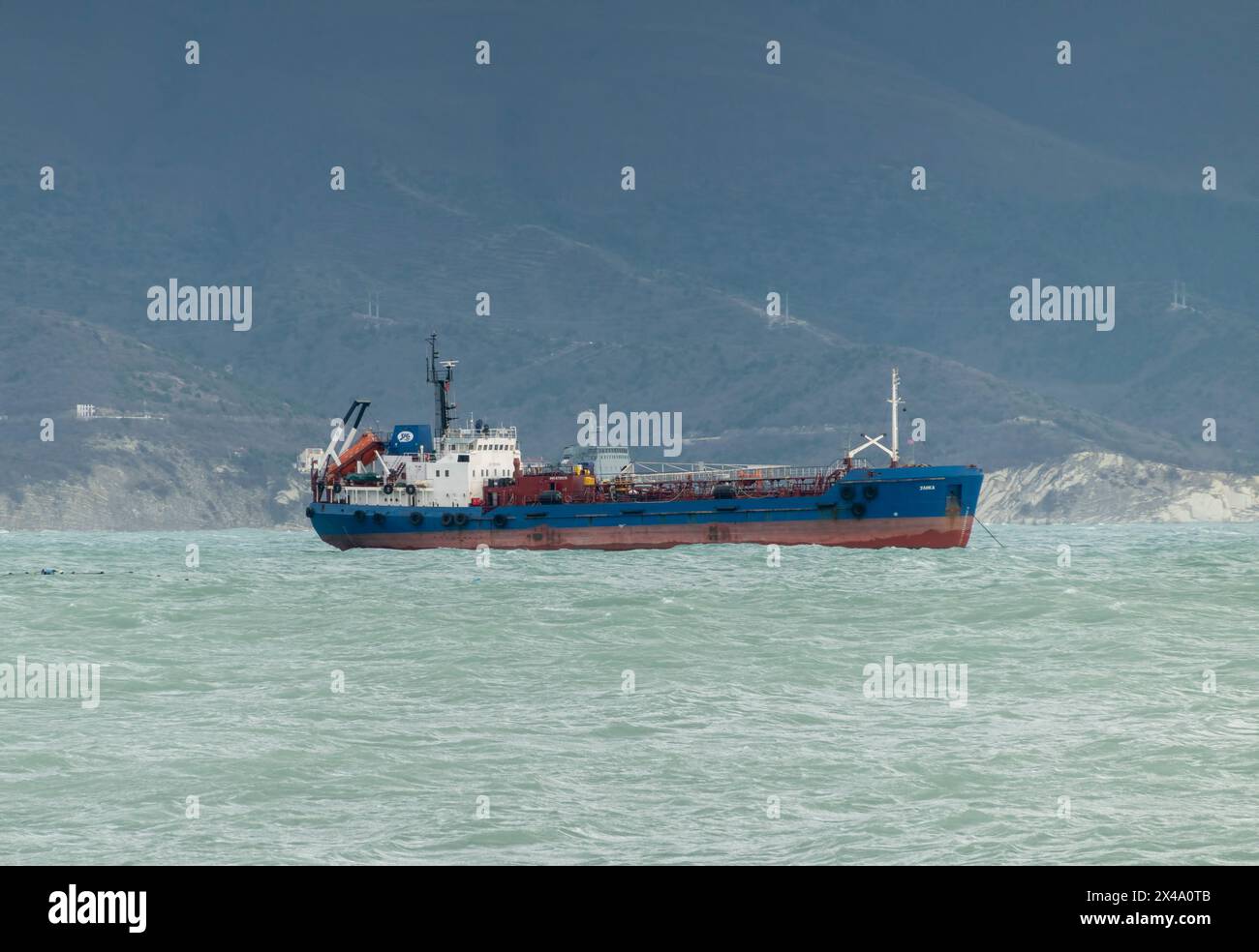 Sea freighter sailing in the middle of the ocean with big waves Stock ...