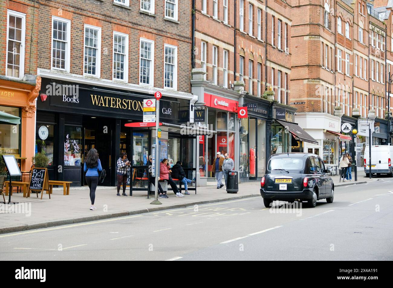 LONDON- APRIL 22, 2024: Hampstead Village high street scene- an ...