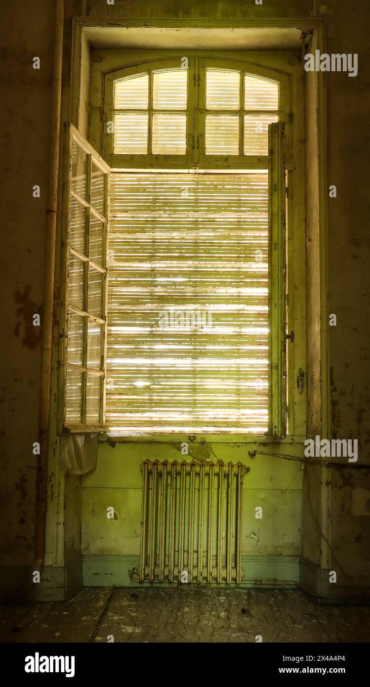 old and aged window with a rusty radiator Stock Photo - Alamy