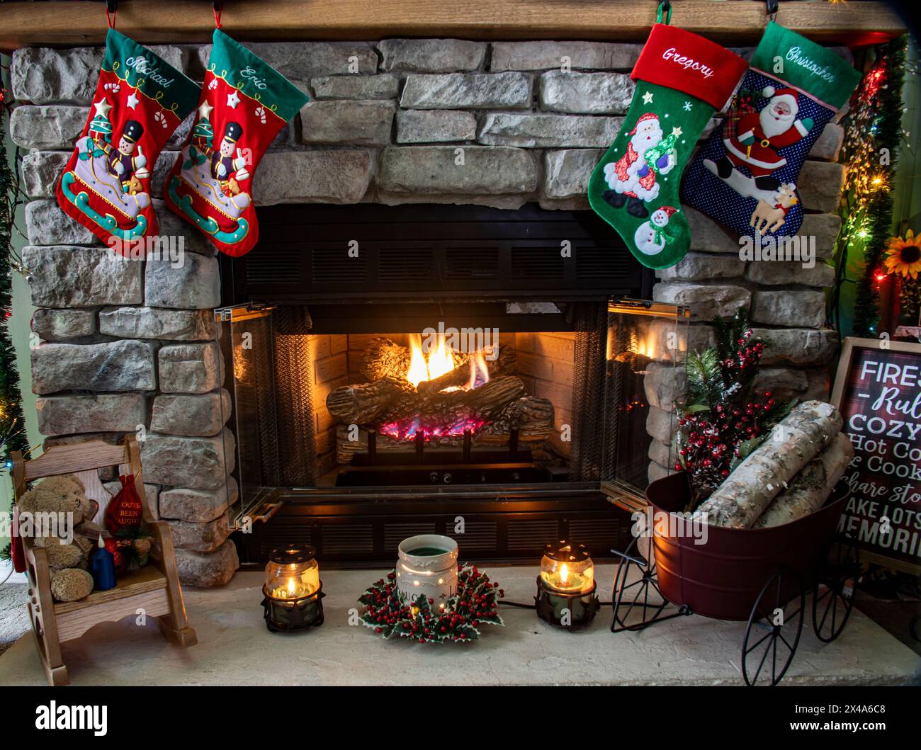 A fireplace with a red and green stocking hanging from it. The stocking ...